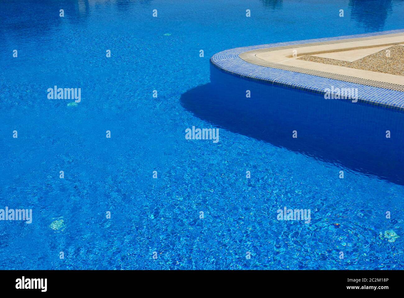 swimming pool blue water in a summer day Stock Photo - Alamy