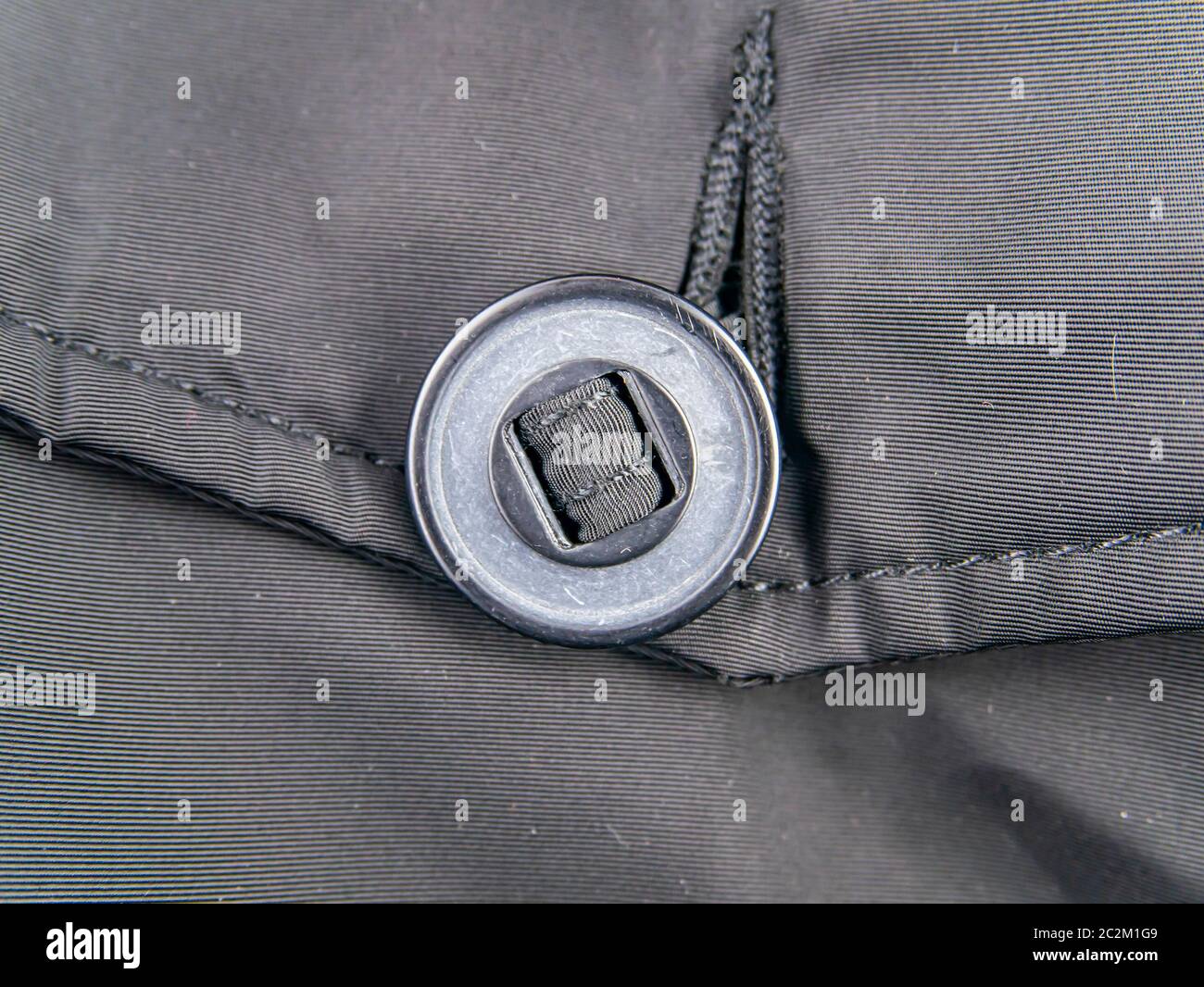 A large button on clothes. Clothing Stock Photo - Alamy