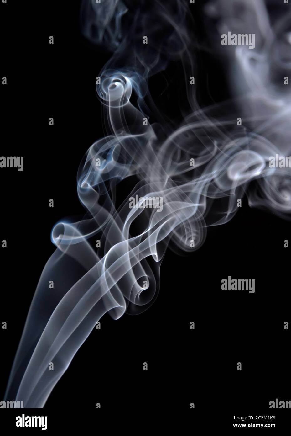 smoke from a cigarrette detail in black background Stock Photo - Alamy