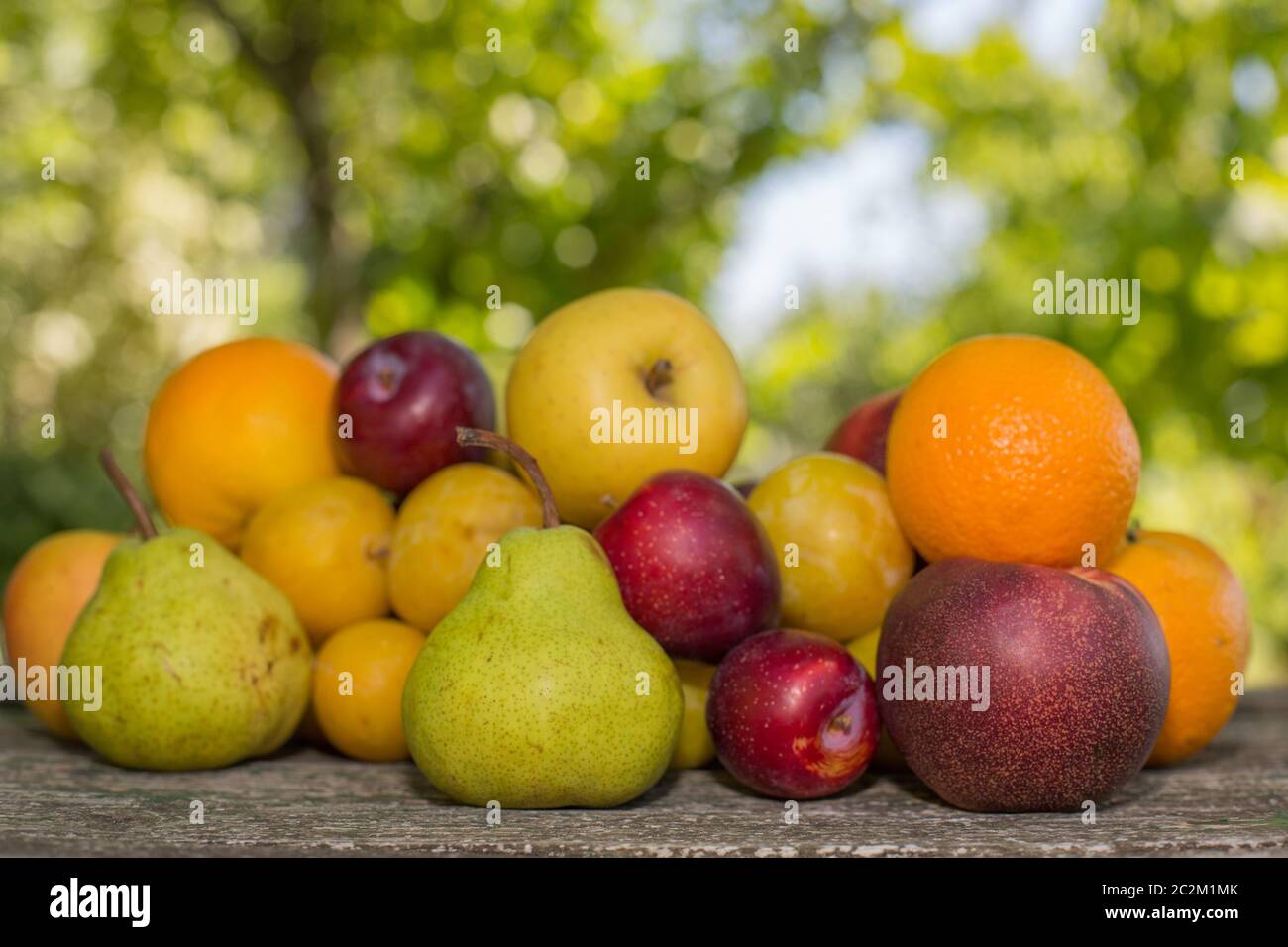 fruits in wooden table, outdoor Stock Photo - Alamy