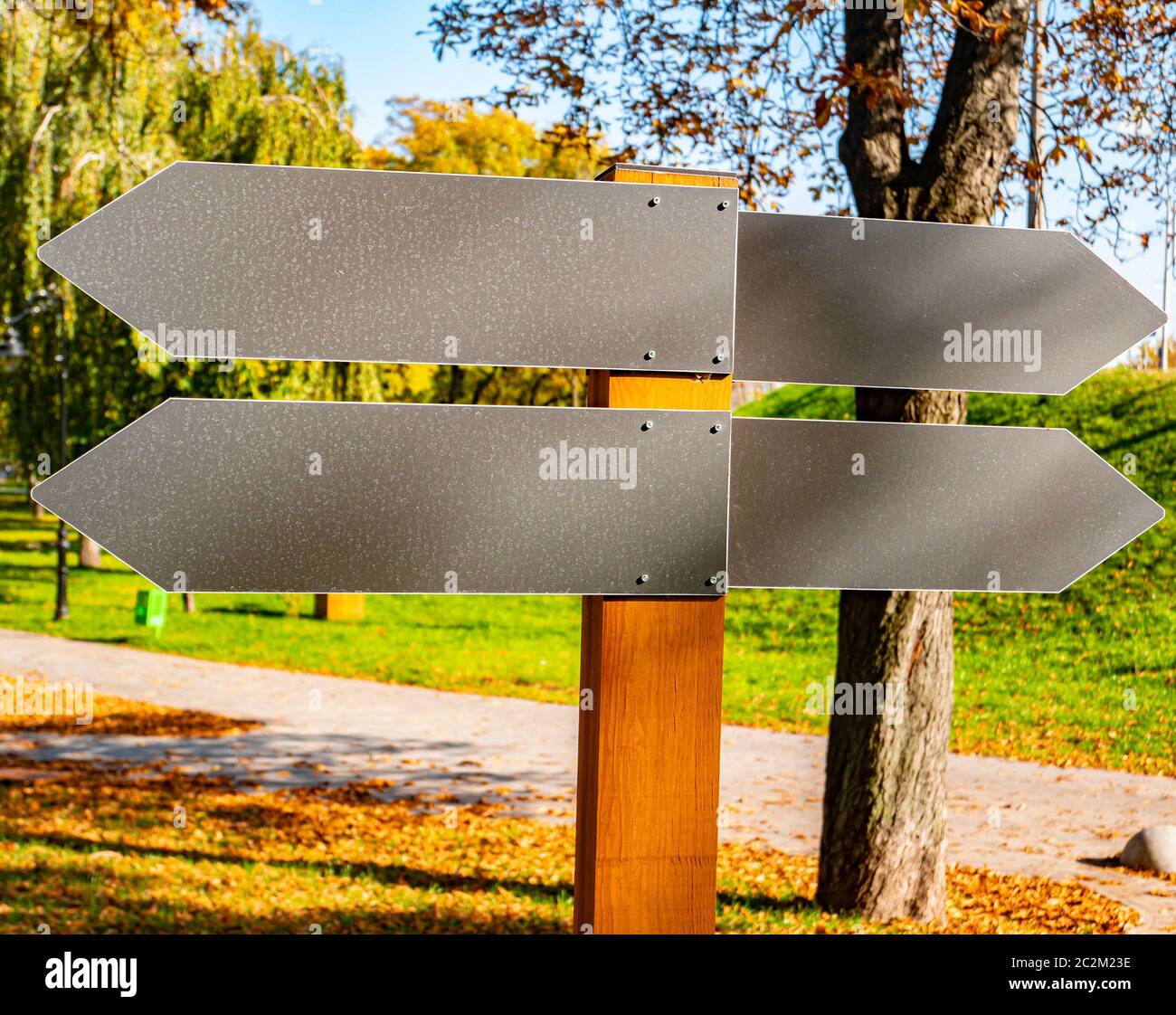Arrows indicating direction in a public park. Pointer. Place for text ...