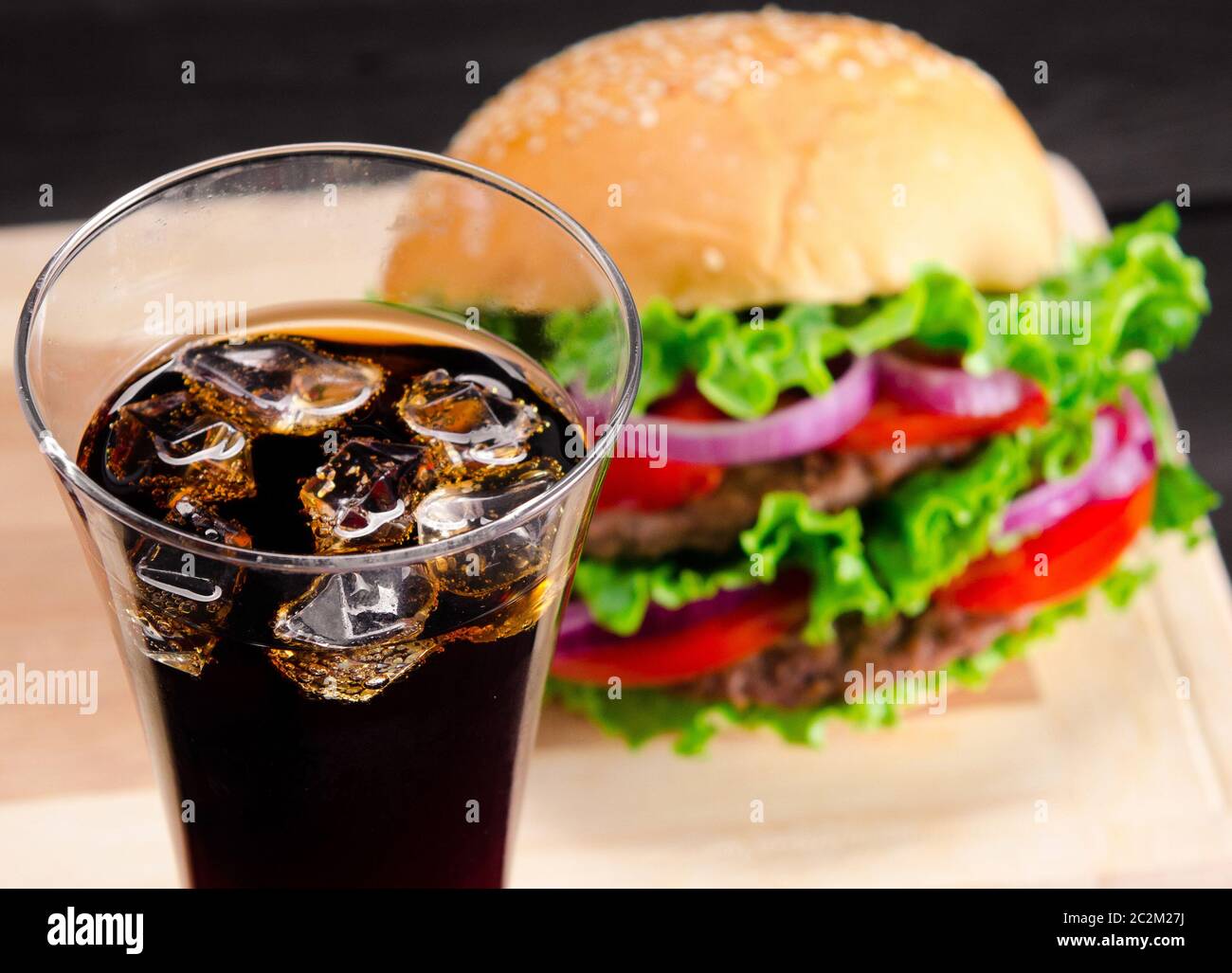 Burger served in bun in nutrition fast food concept Stock Photo - Alamy