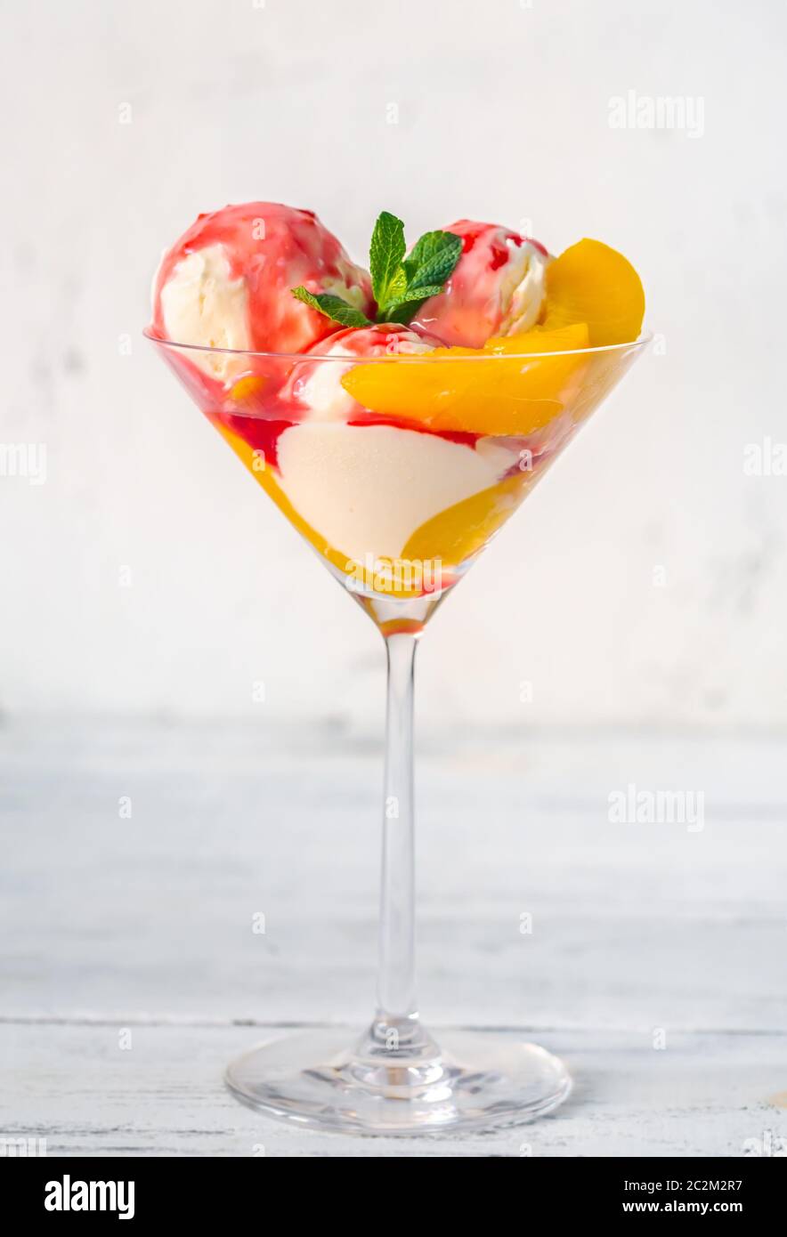 Peach Melba - dessert of peaches and raspberry sauce with vanilla ice ...