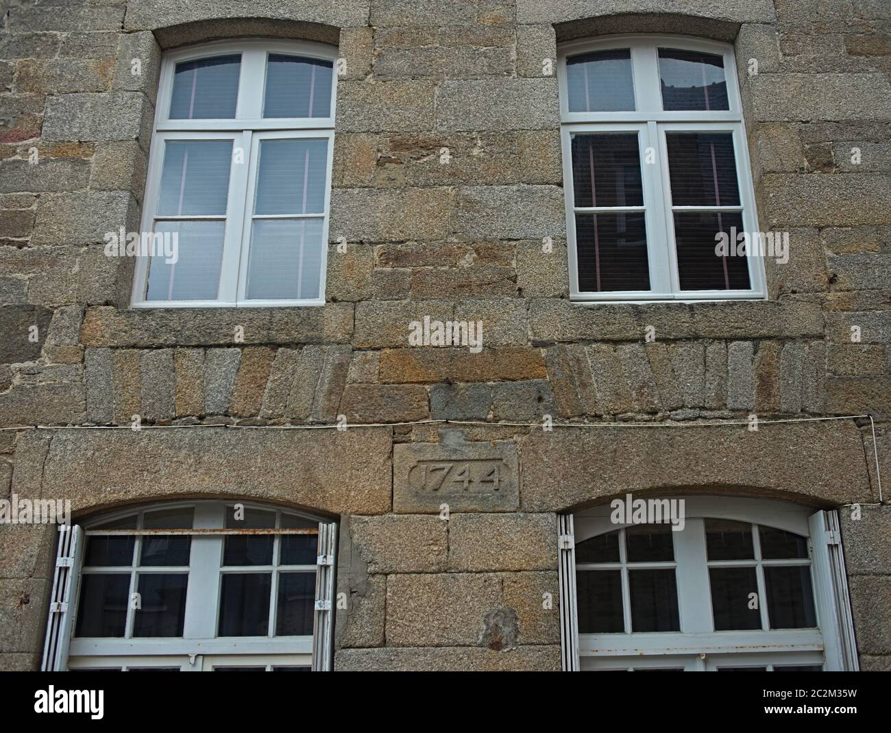Traditional french stone building with many windows Stock Photo - Alamy