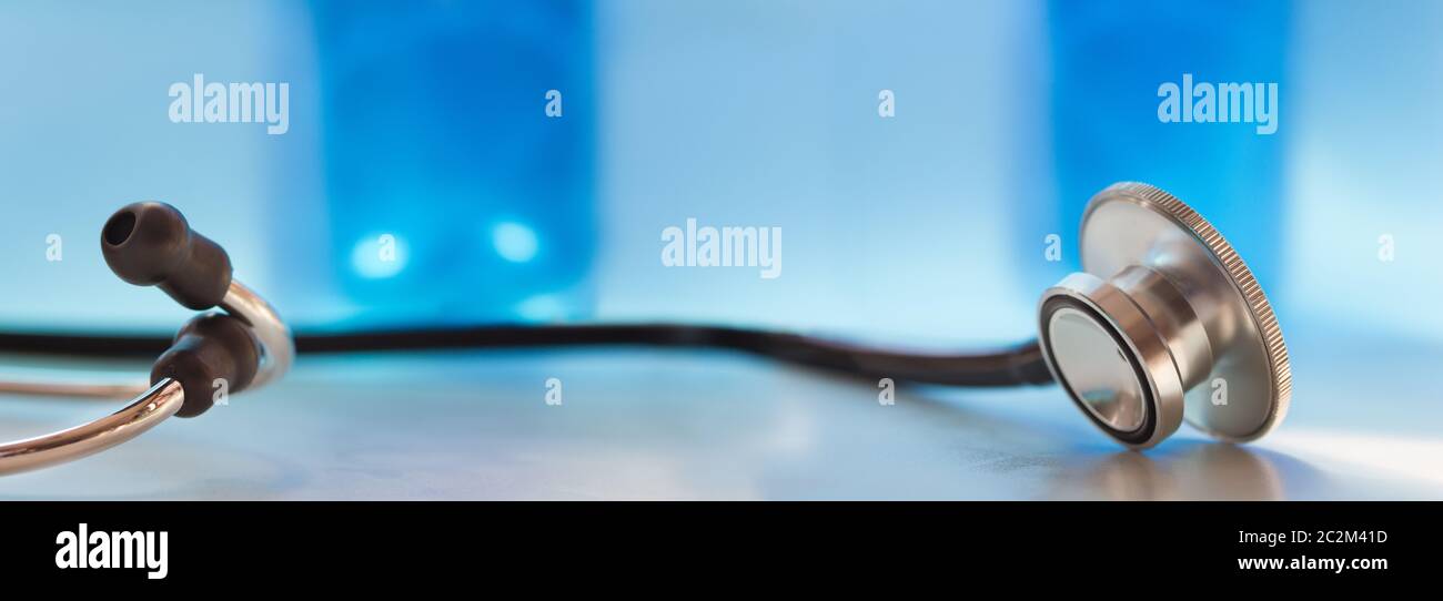 Stethoscope closeup banner or blue background for medical doctor with ...