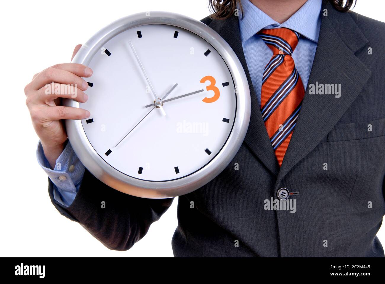 business man wearing suit holding clock detail Stock Photo - Alamy