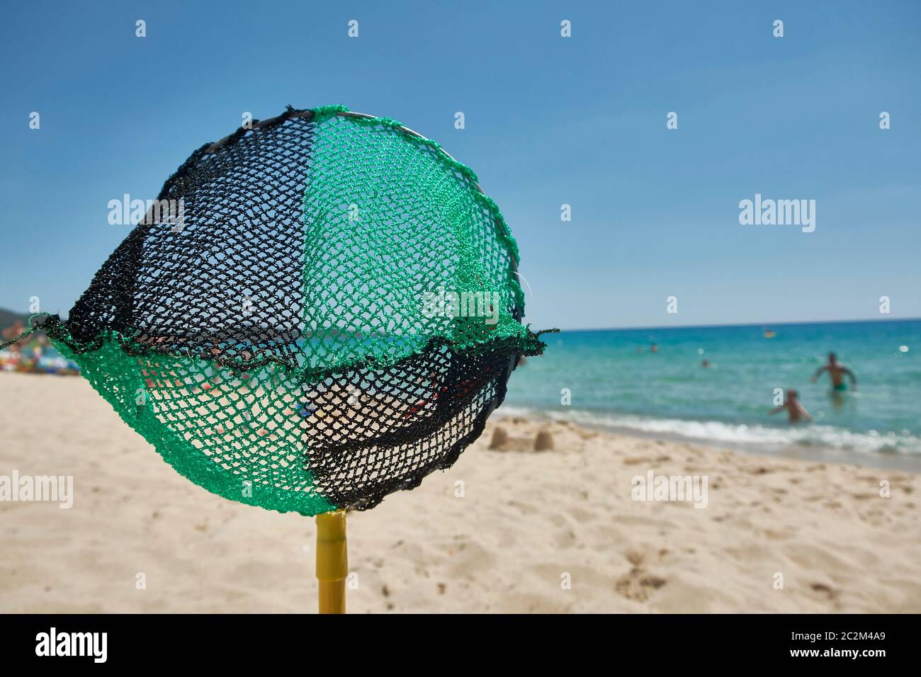 Netting net used by beach fishermen to collect small fish from the ...