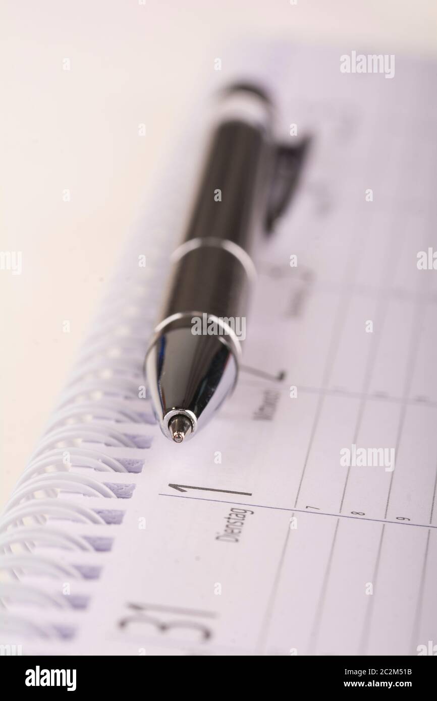 an Organlizer and a pen Stock Photo - Alamy