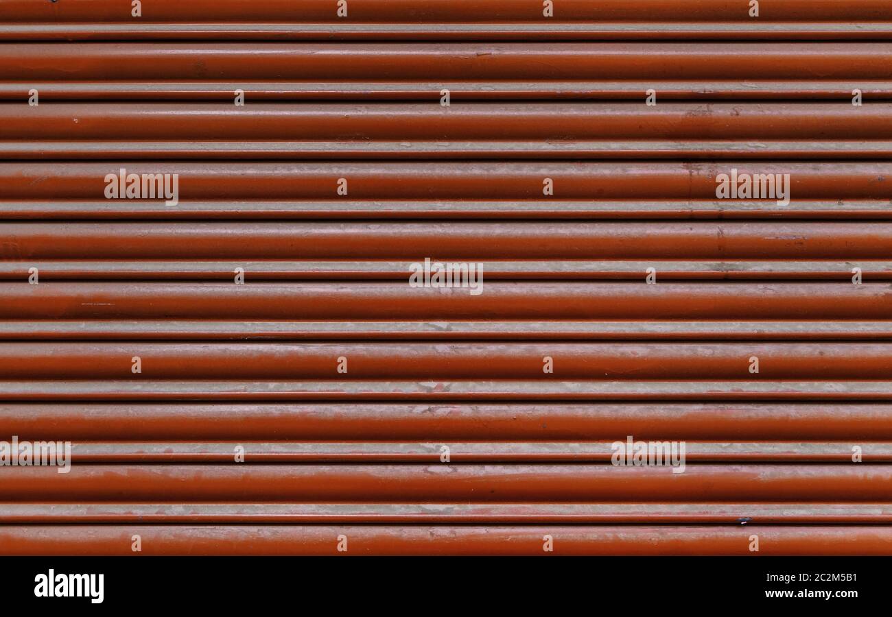 Red metal wall, metallic background detail painted red, protection ...