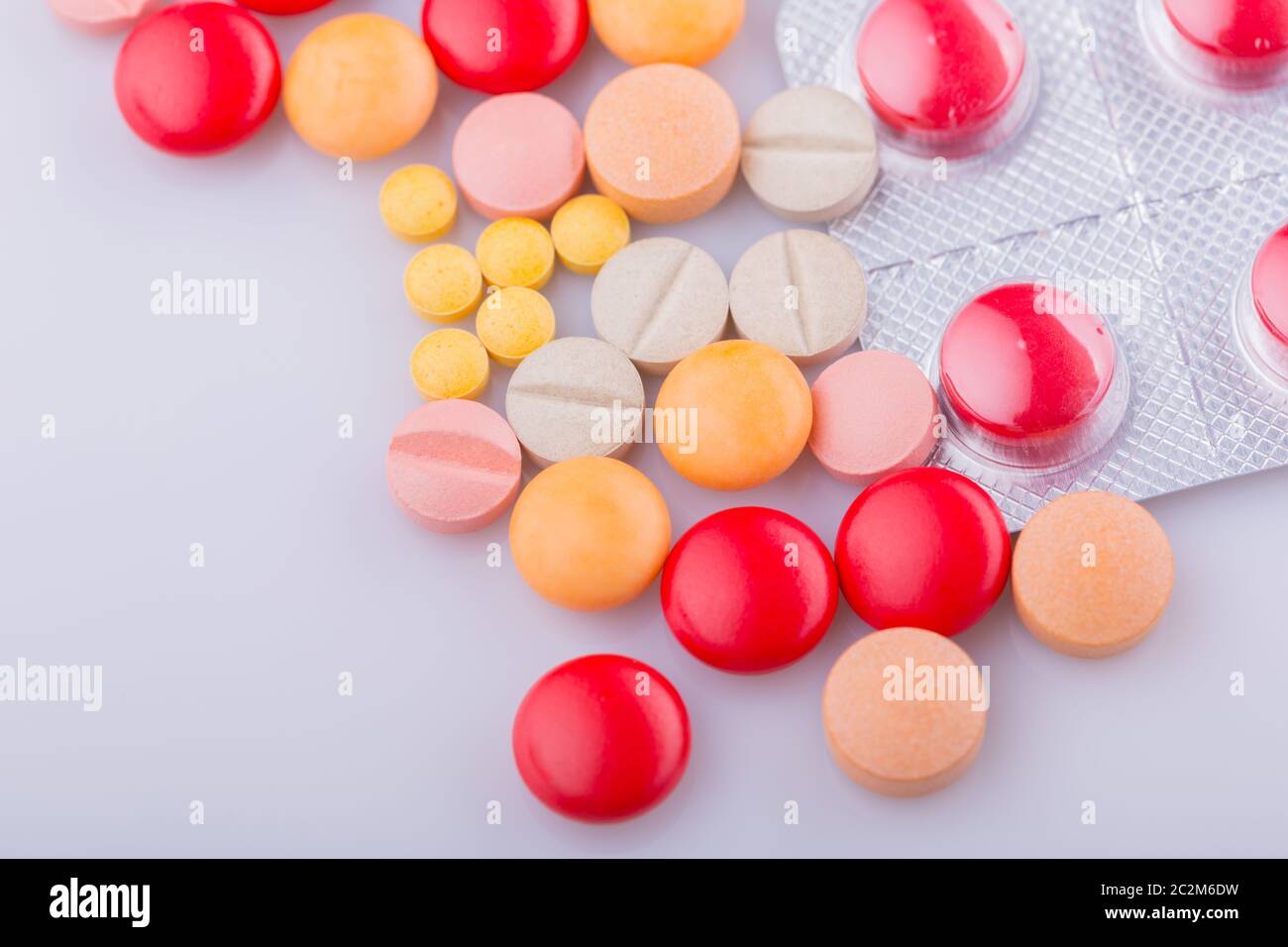 Tablets pills capsule heap mix therapy drugs, over a white background ...