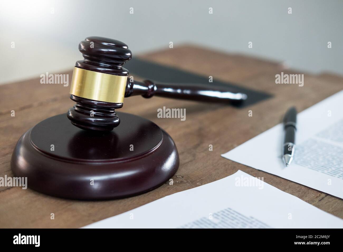 Symbol of Judge law attorney gavel with Justice lawyers table desktop ...