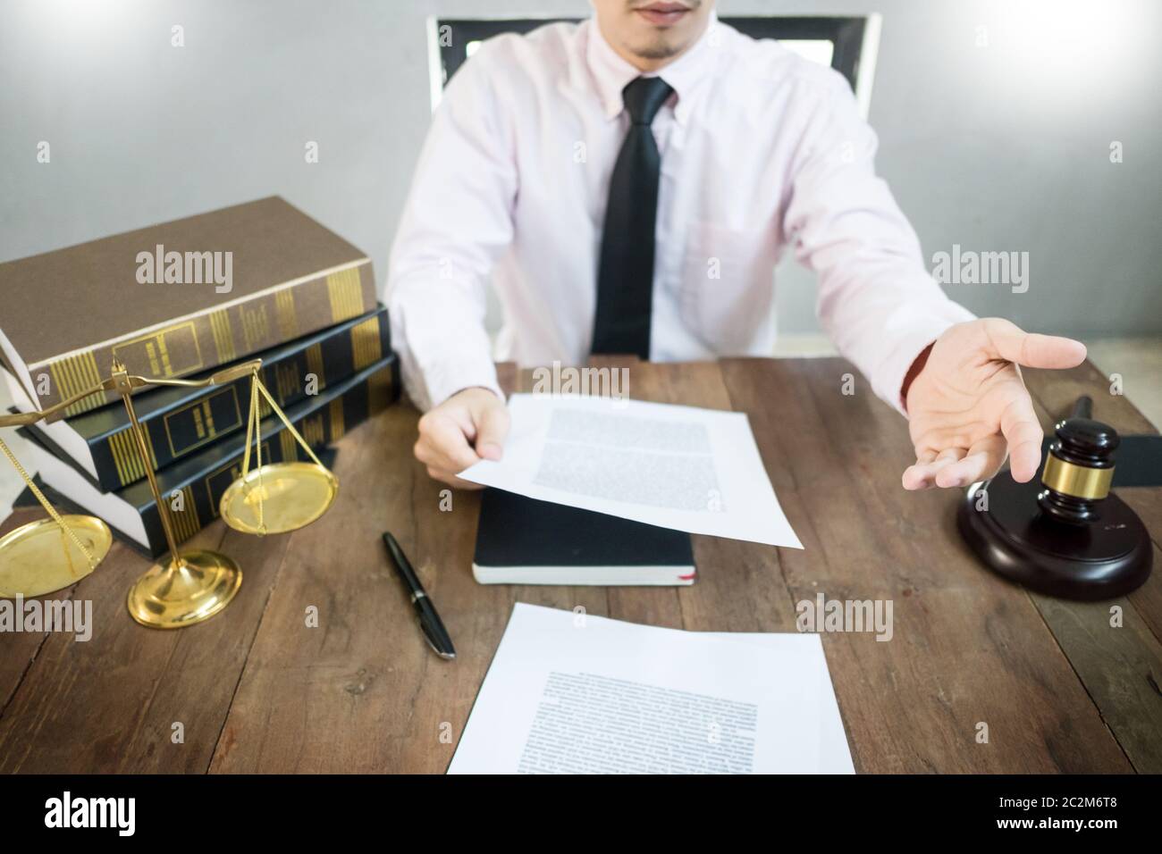 lawyer judge reading documents at desk in courtroom working on wooden ...