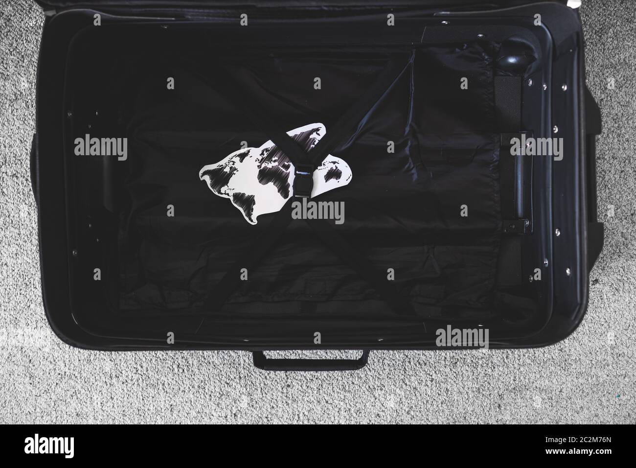 travel and aviation industry concept, open carry-on luggage with world ...