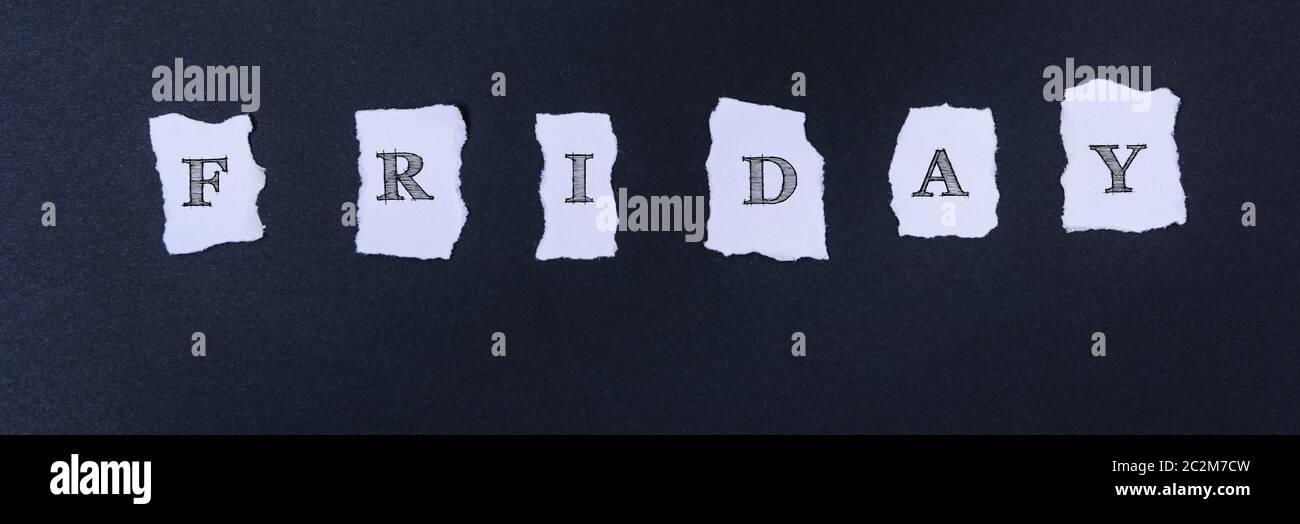 Friday words text into white paper torn on black background Stock Photo ...