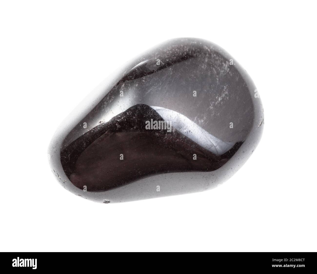 closeup of sample of natural mineral from geological collection - polished Obsidian (volcanic ...