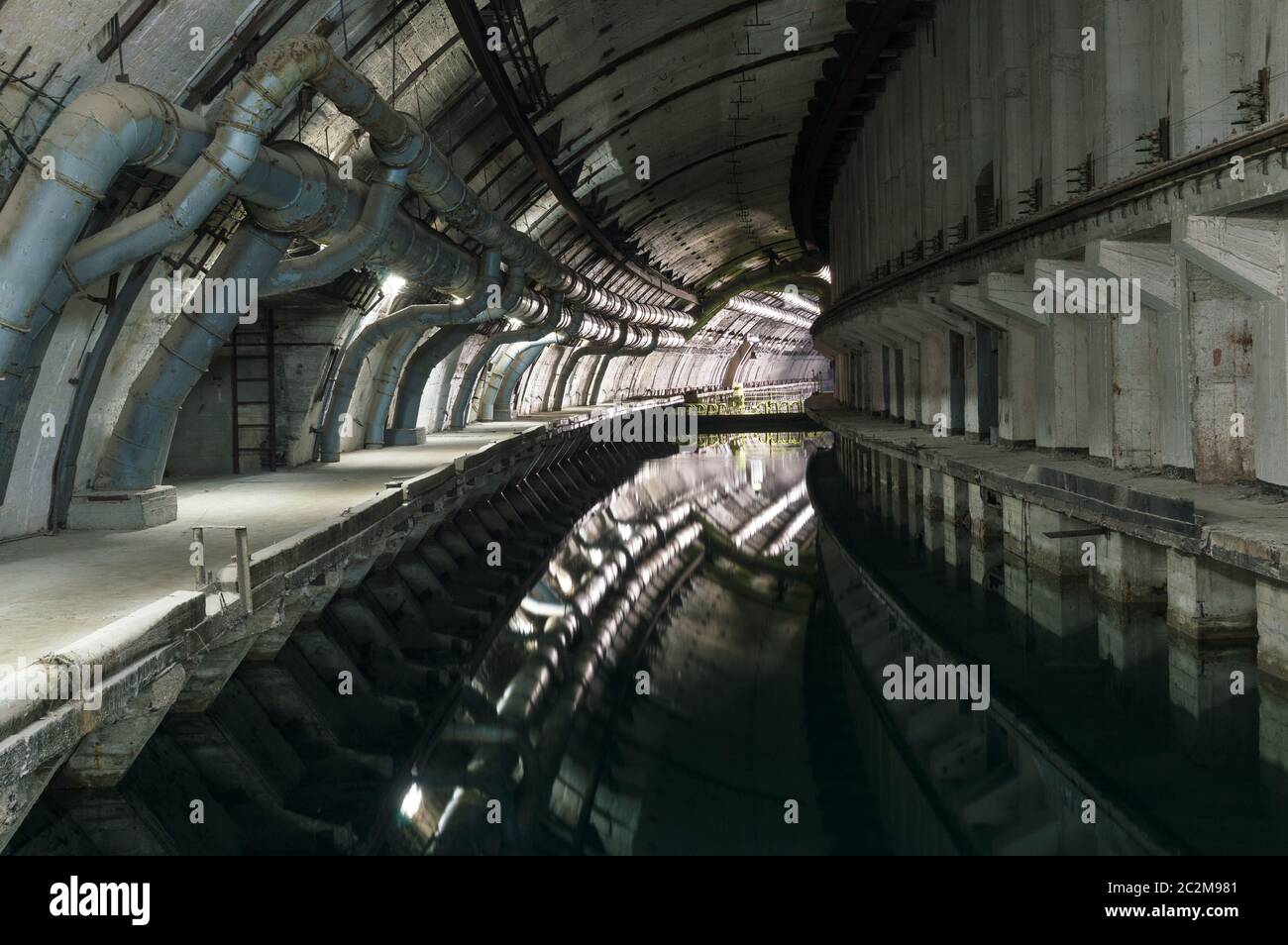 Underground Tunnel with Water for passage and repair submarines Stock ...
