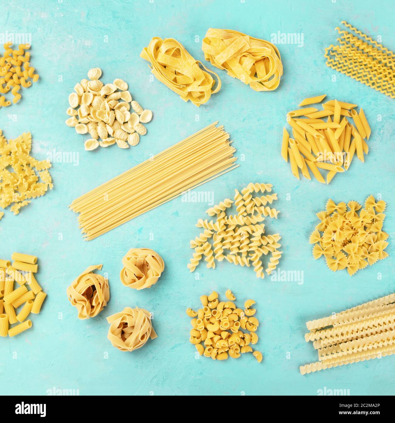Italian pasta variety, square flatlay banner, top shot on a blue ...