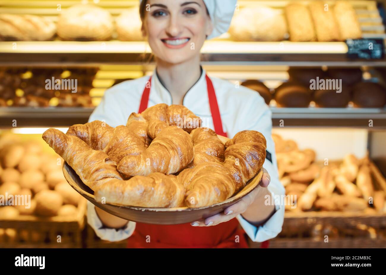 Bread bakery offering woman hi-res stock photography and images - Alamy