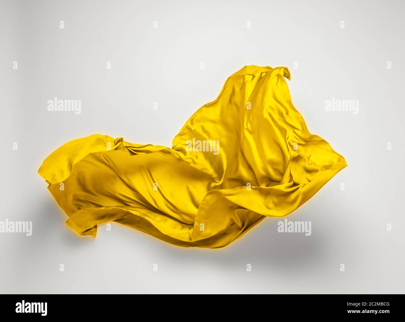 abstract piece of yellow fabric flying, high-speed studio shot Stock ...