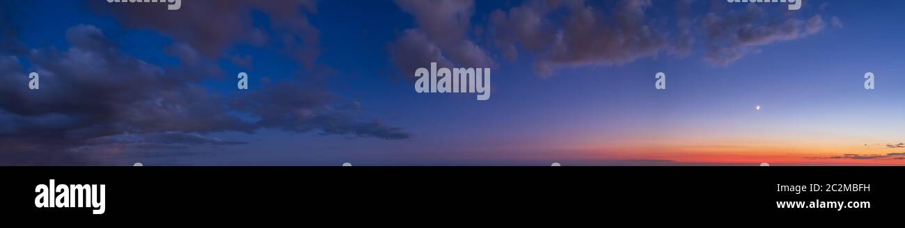 Sunset sky background with clouds and Moon Stock Photo - Alamy