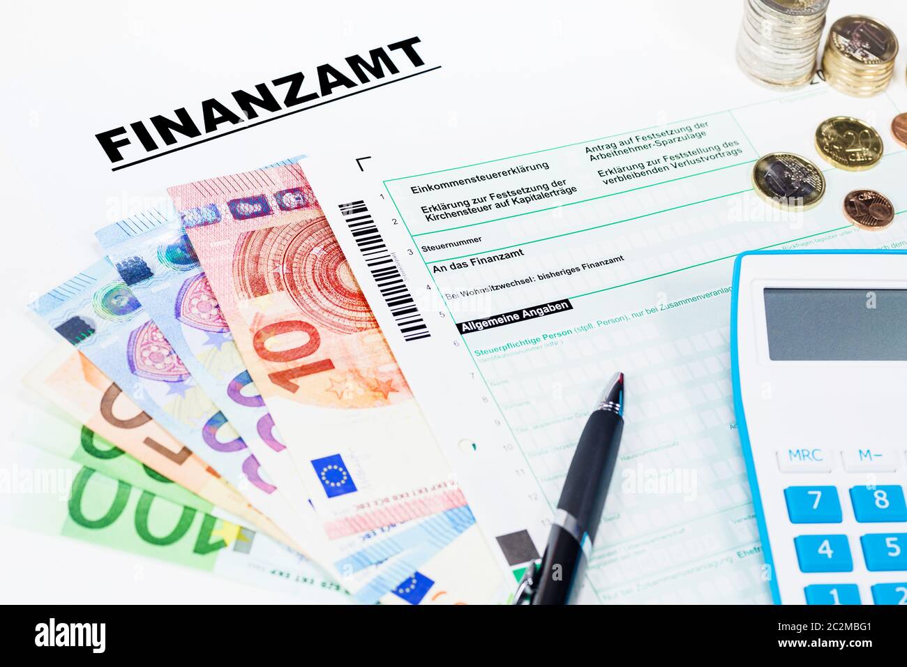 income tax with forms and calculator Stock Photo - Alamy