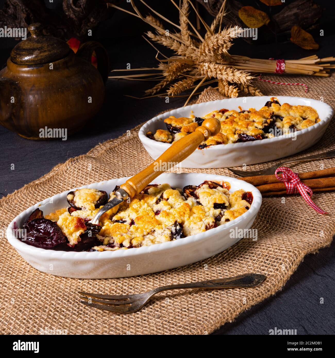 Cinnamon prunes with crumble Stock Photo - Alamy