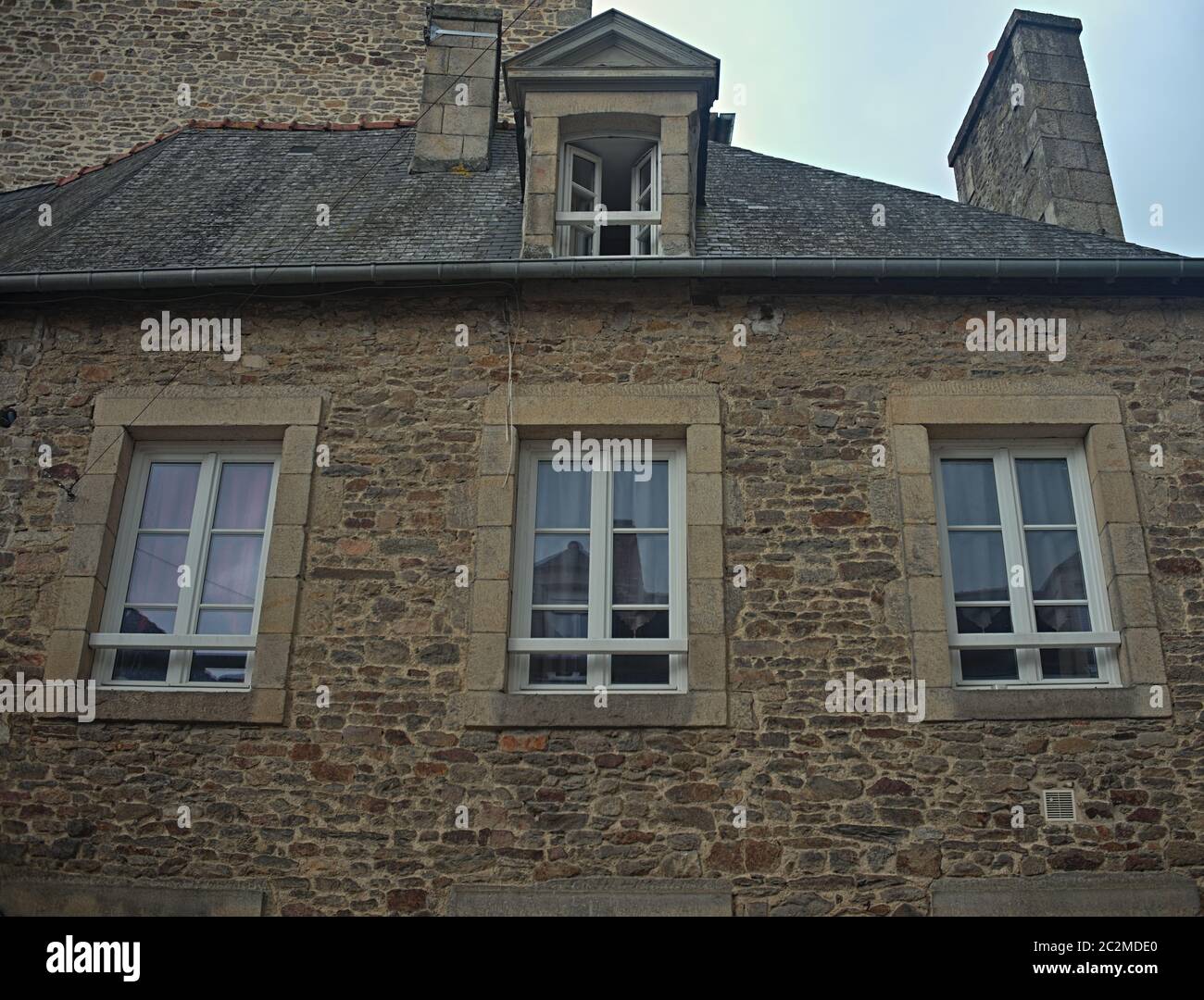 Traditional french stone building with many windows Stock Photo - Alamy