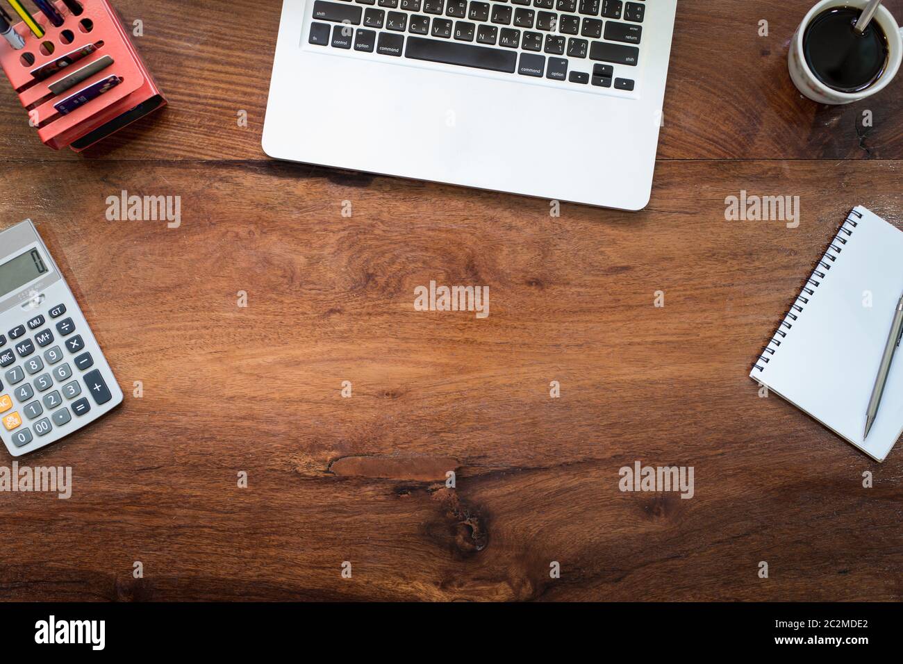 Laptop on Vintage Wooden desktop in modern office with accessories ...