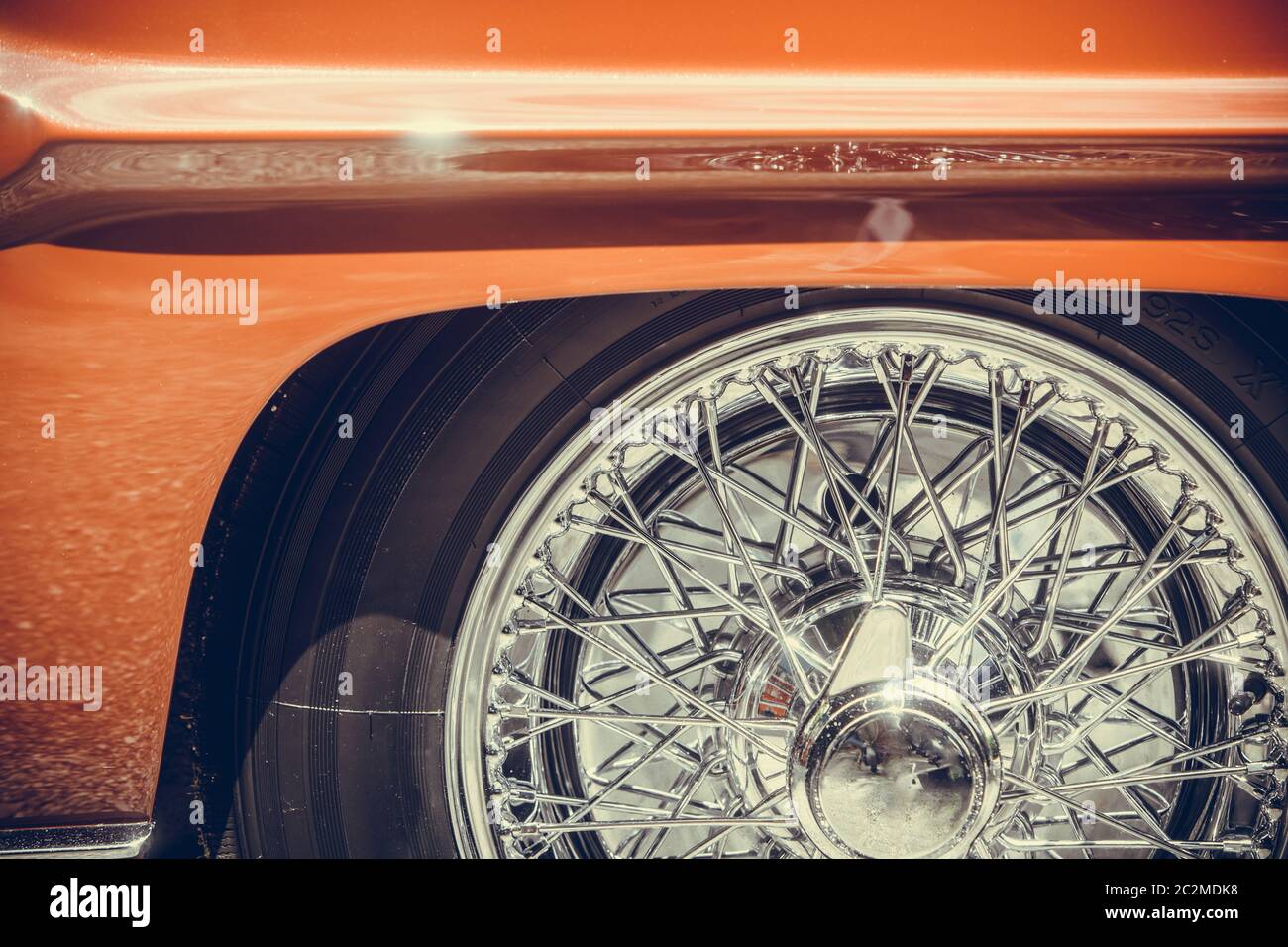 Close up shot of a vintage classic car spoke wheel Stock Photo - Alamy
