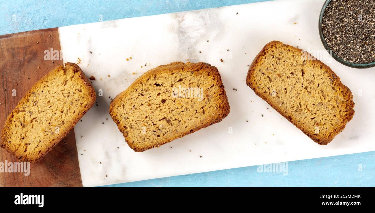 Chia seed cake, close-up panoramic top shot on a marble cutting board ...