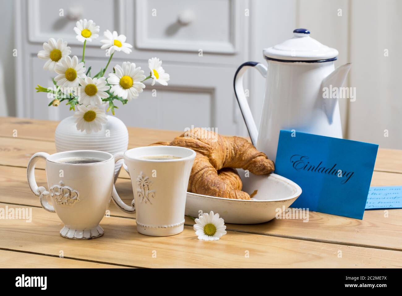 Continental breakfast table setting with tea in a cup hi-res stock ...