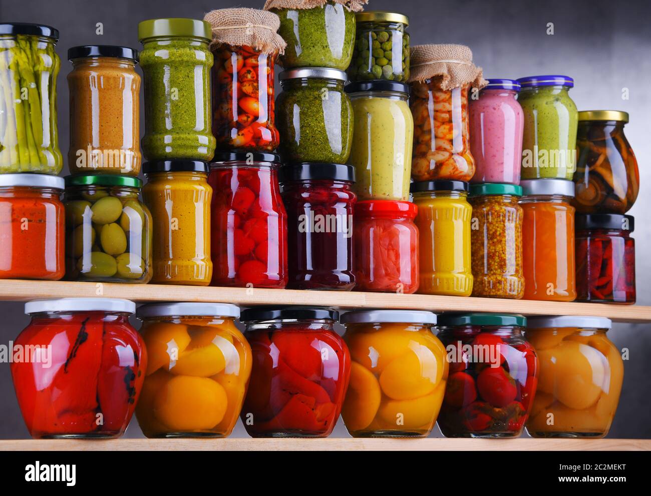 Jars with variety of pickled vegetables and fruits. Preserved food ...