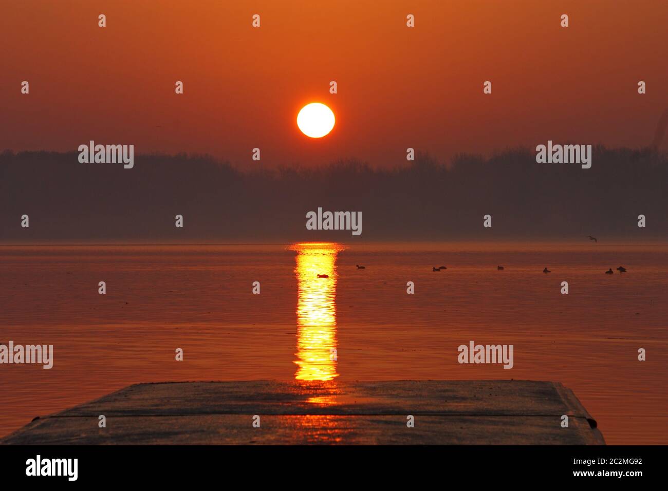 Colorful dawn on the beach Stock Photo - Alamy