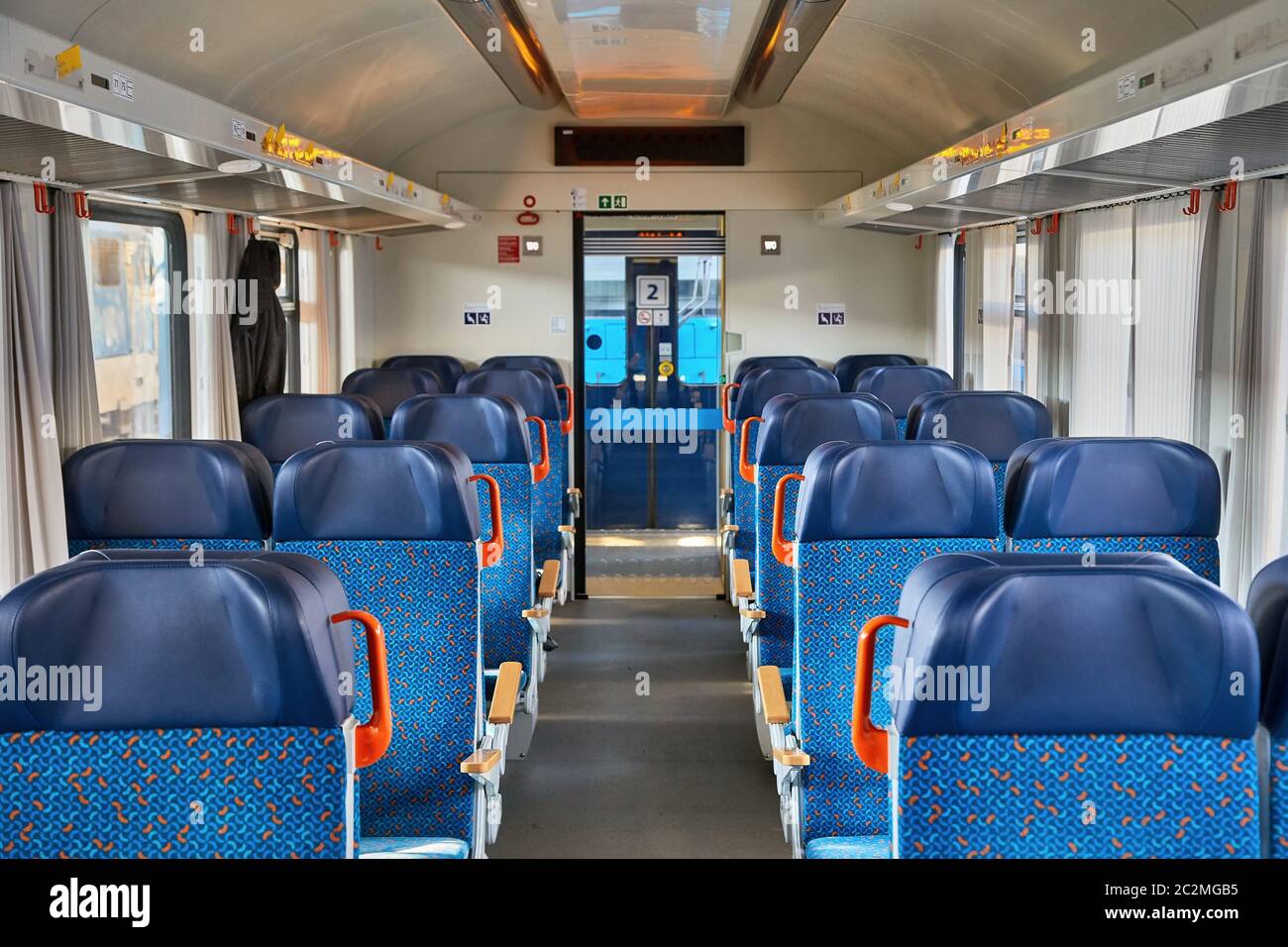 Interior of a passenger train with empty seats Stock Photo - Alamy