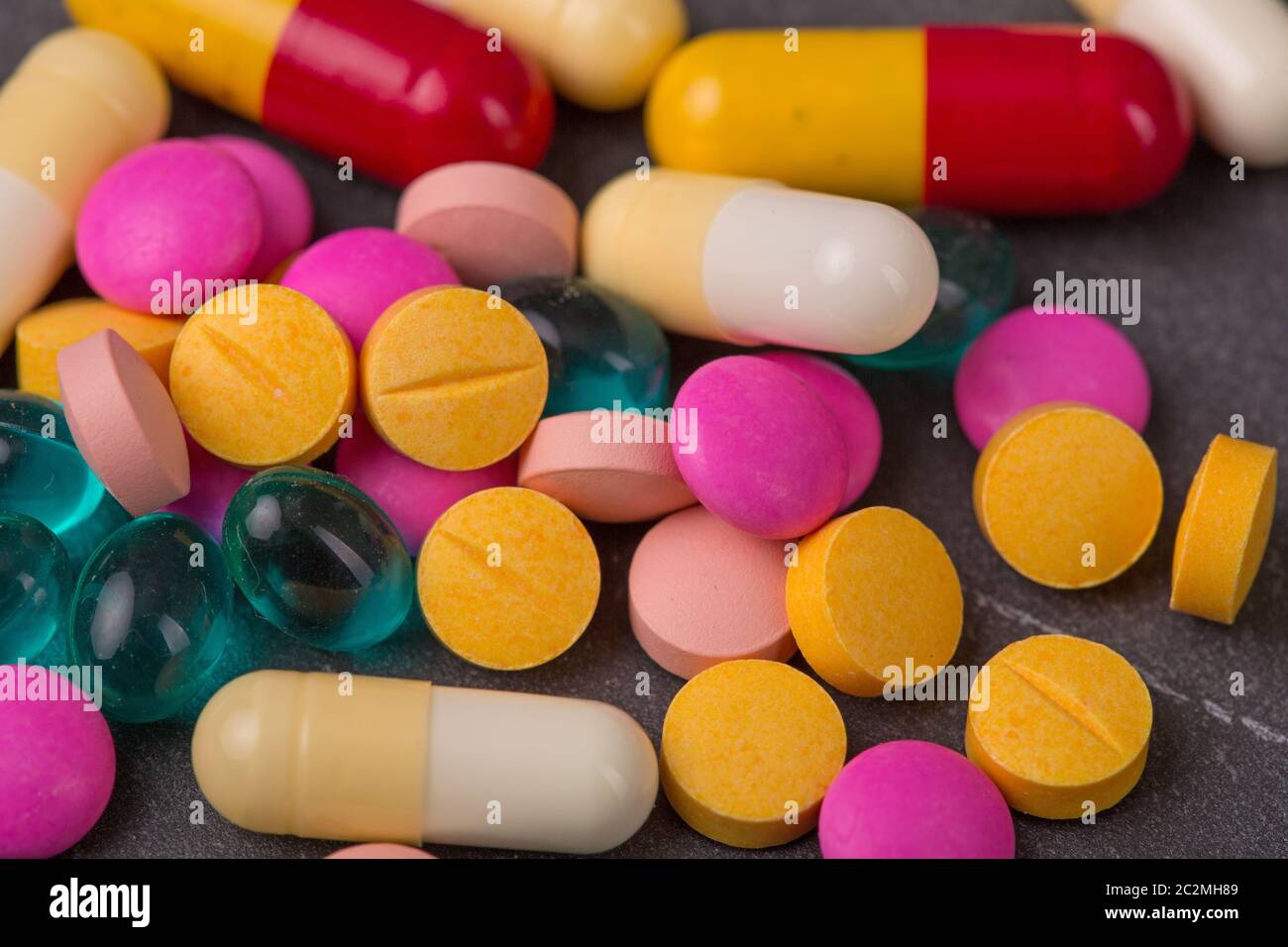 different tablets pills capsule heap mix therapy drugs Stock Photo - Alamy