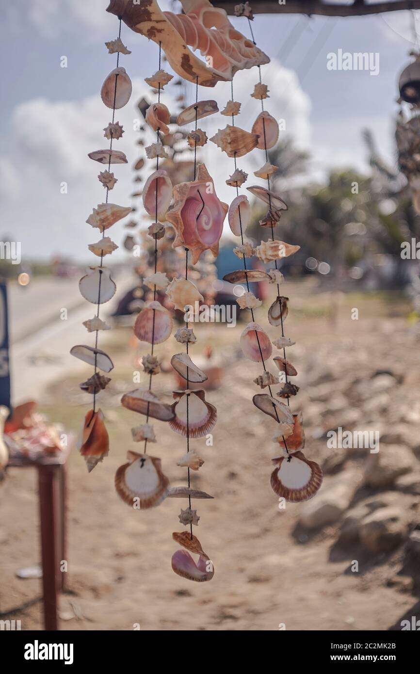 Stand full of dreamcatchers made with shells in a small street of Isla ...