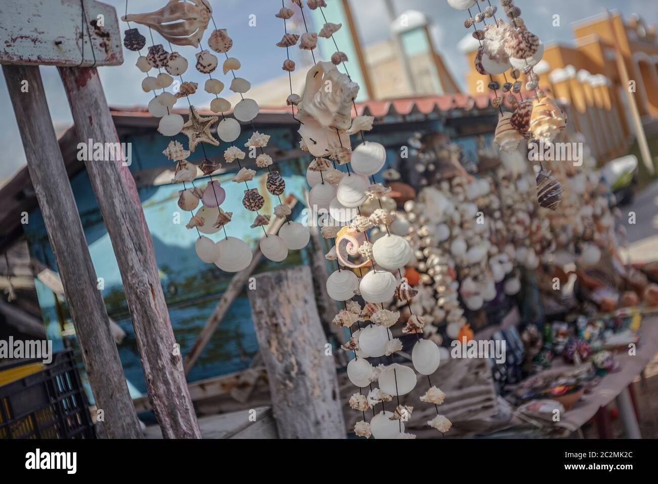 Stand full of dreamcatchers made with shells in a small street of Isla ...