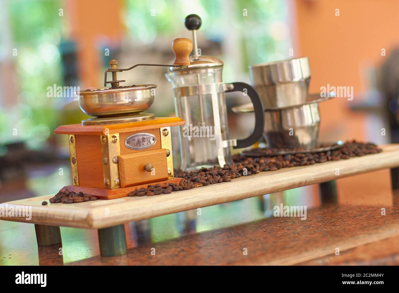 Still life with a vintage coffee grinder, coffee beans and other ...