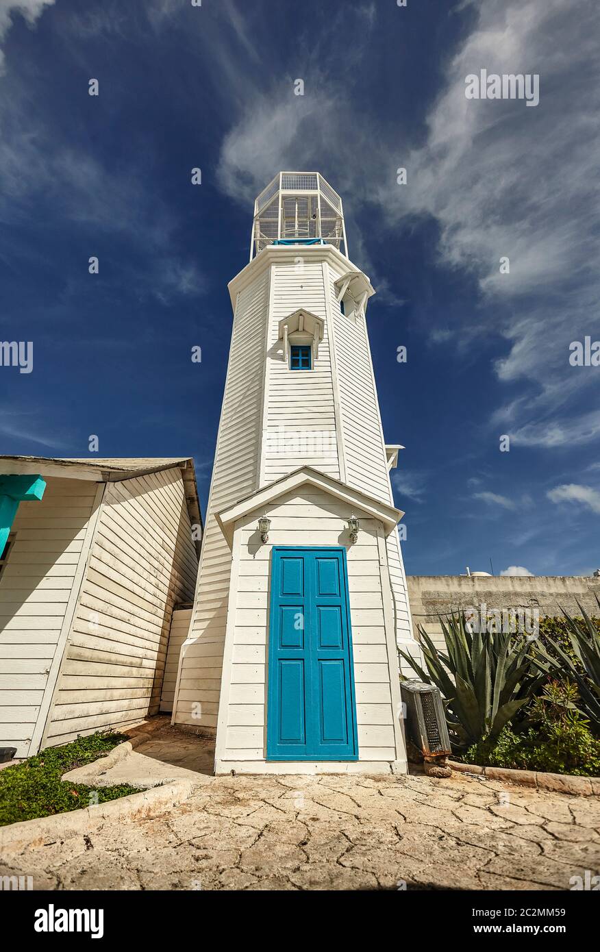 White and blue lighthouse: the lighthouse of Isla Mujeres in Mexico ...
