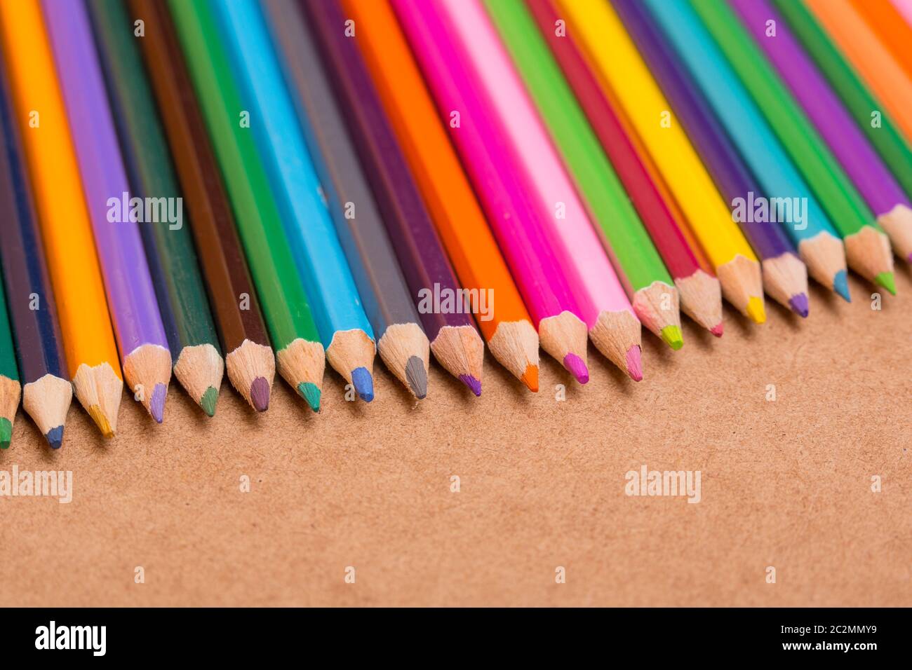 Wooden colorful pencils, on wooden table Stock Photo - Alamy
