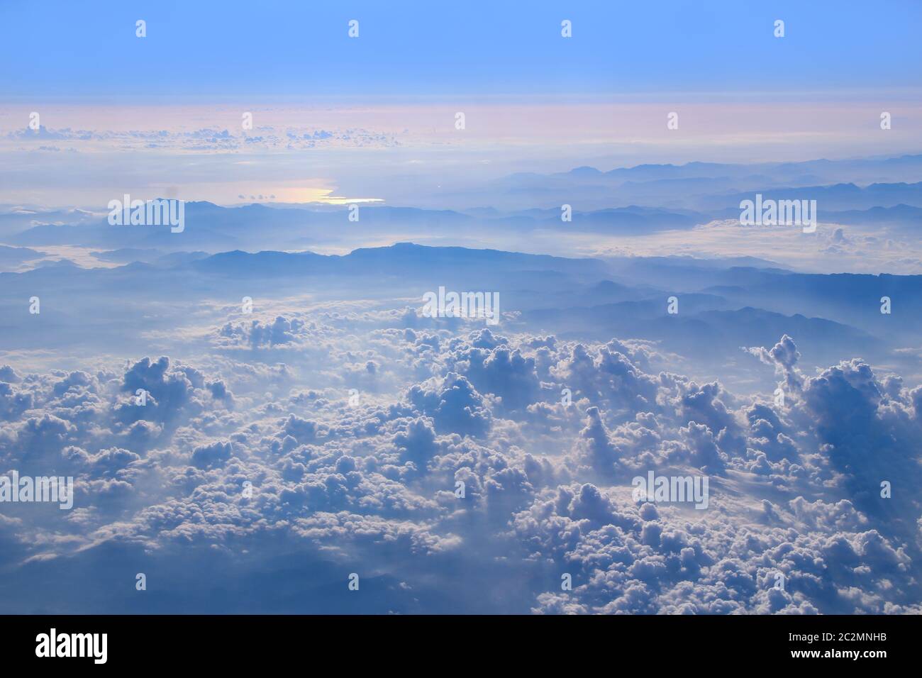 Flight above clouds. Wonderful panorama from window of plane with white ...