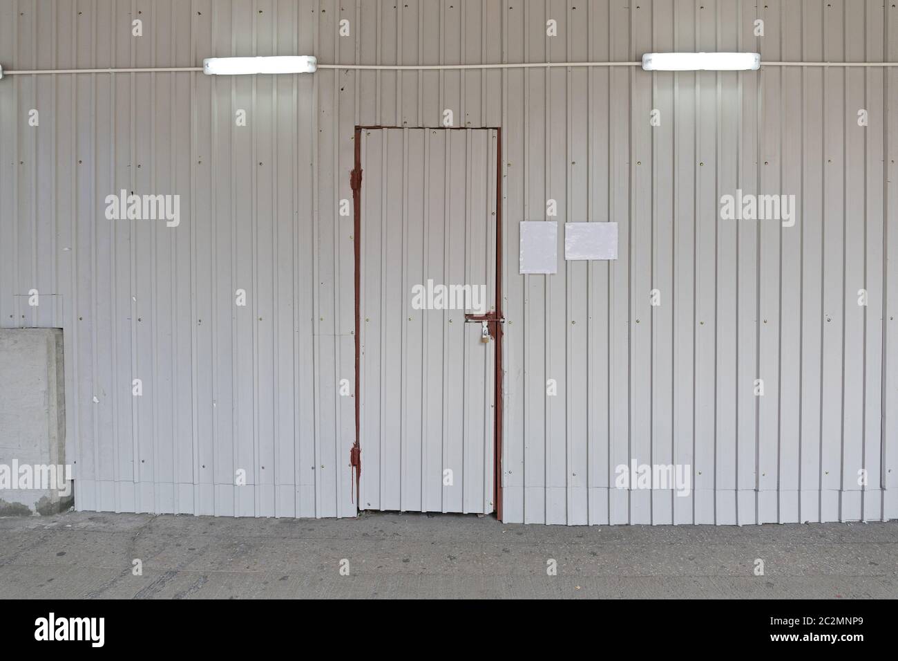 Closed Door at Construction Site White Building Stock Photo - Alamy