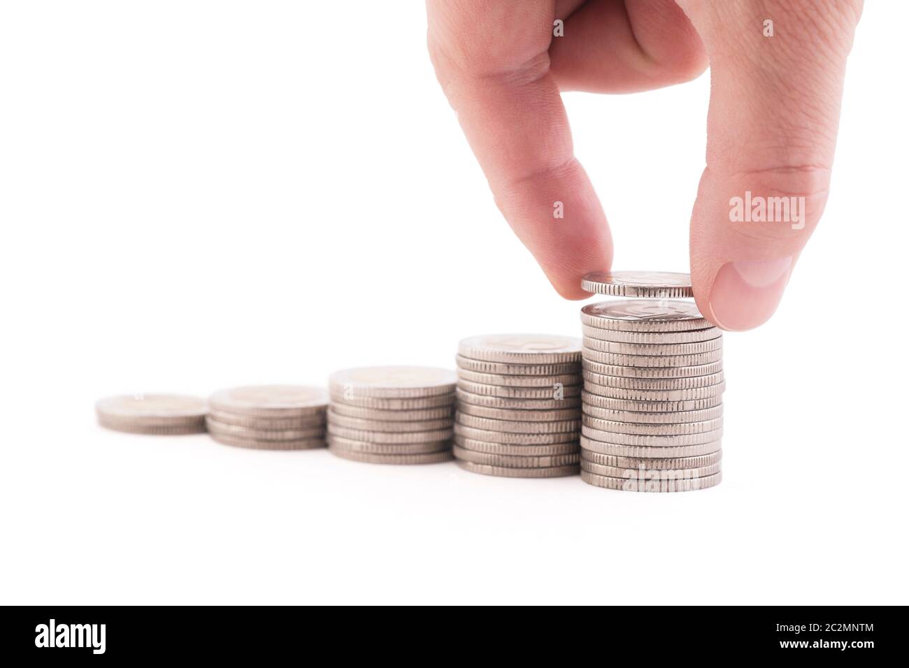 Rising stack of coins isolated on white background with clipping path ...