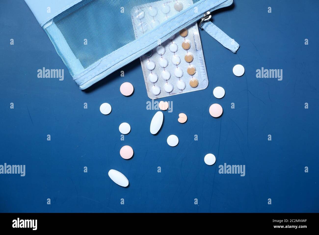 birth control pills on blue background, Top view Stock Photo - Alamy