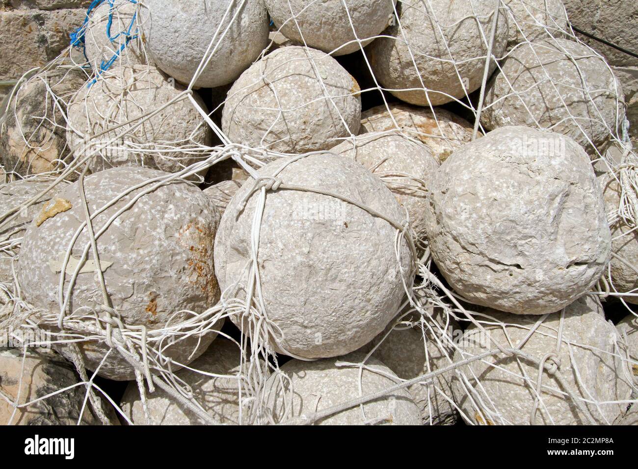 Bunch of medieval stone cannon balls Stock Photo - Alamy