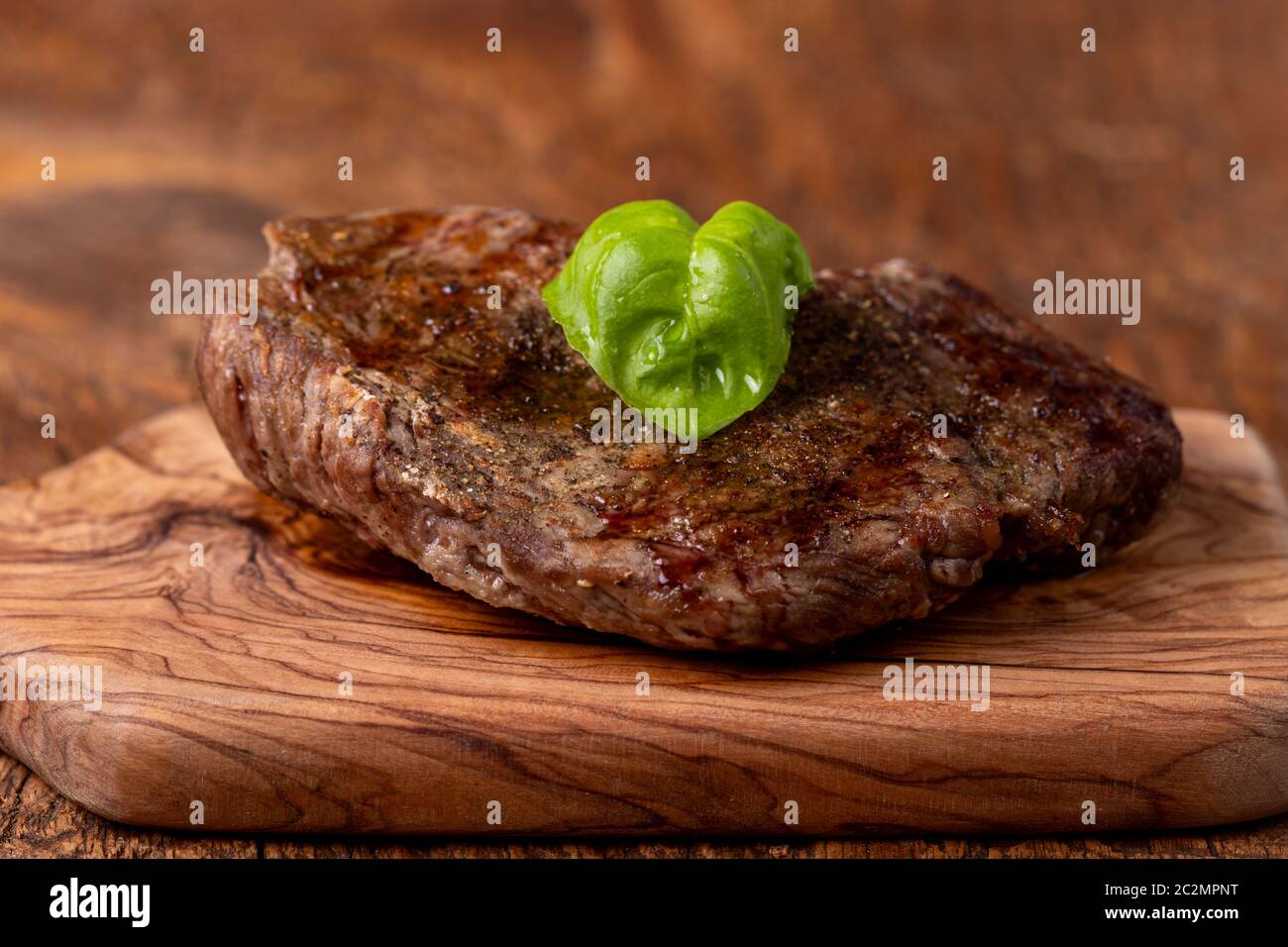 overview of a grilled steak on wood Stock Photo - Alamy