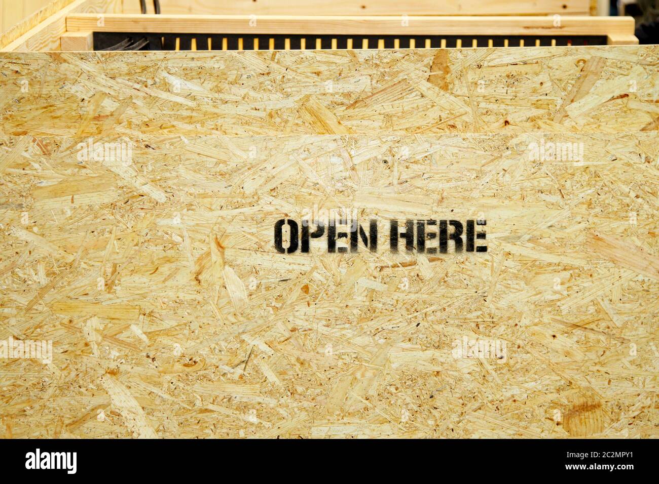 Open here sign at recycled wooden crate box Stock Photo - Alamy
