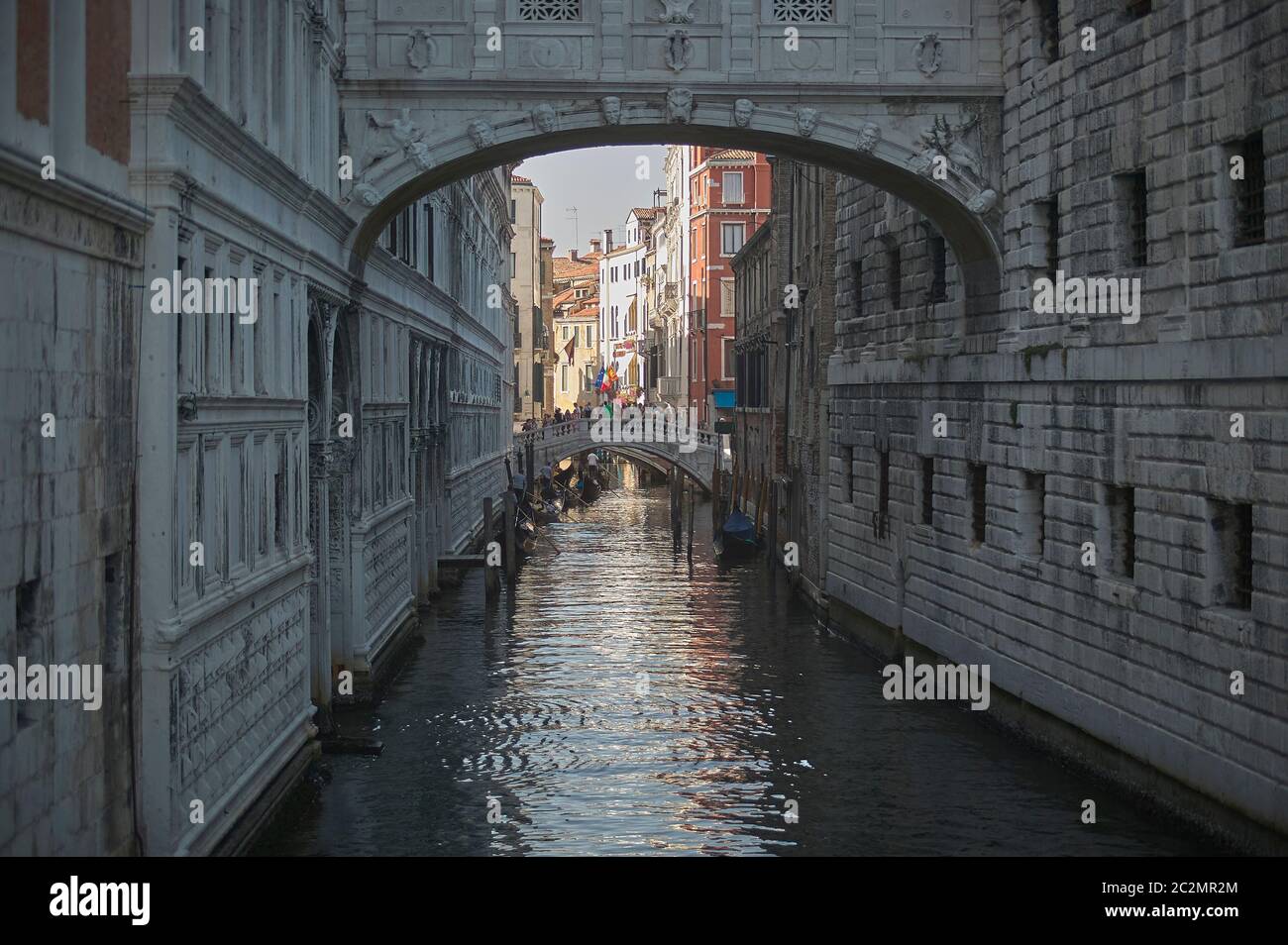 Small water course in Venice surrounded by highly decorated historic ...