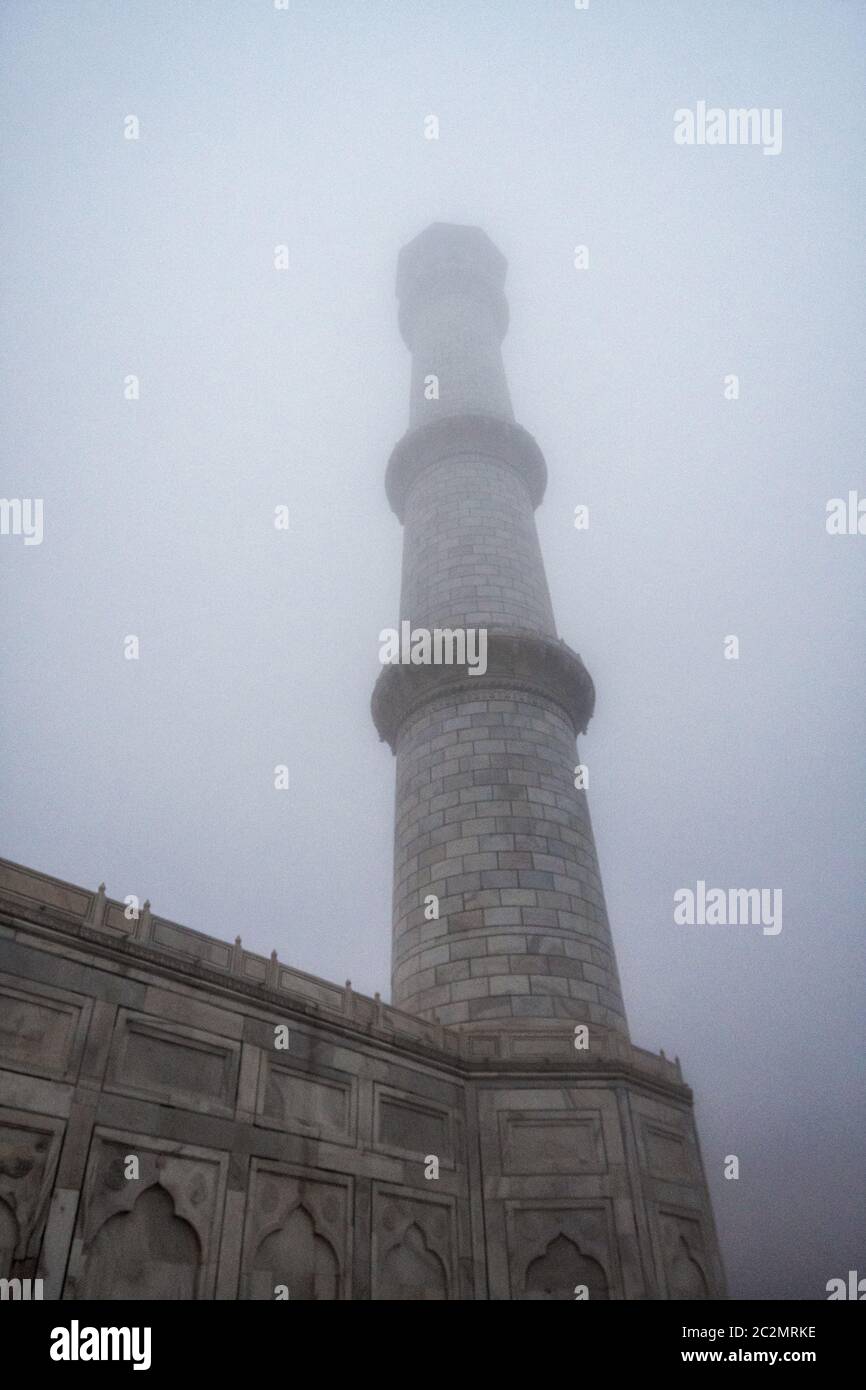 taj mahal covered and surrounded in deep fog. Famous landmark in Agra ...