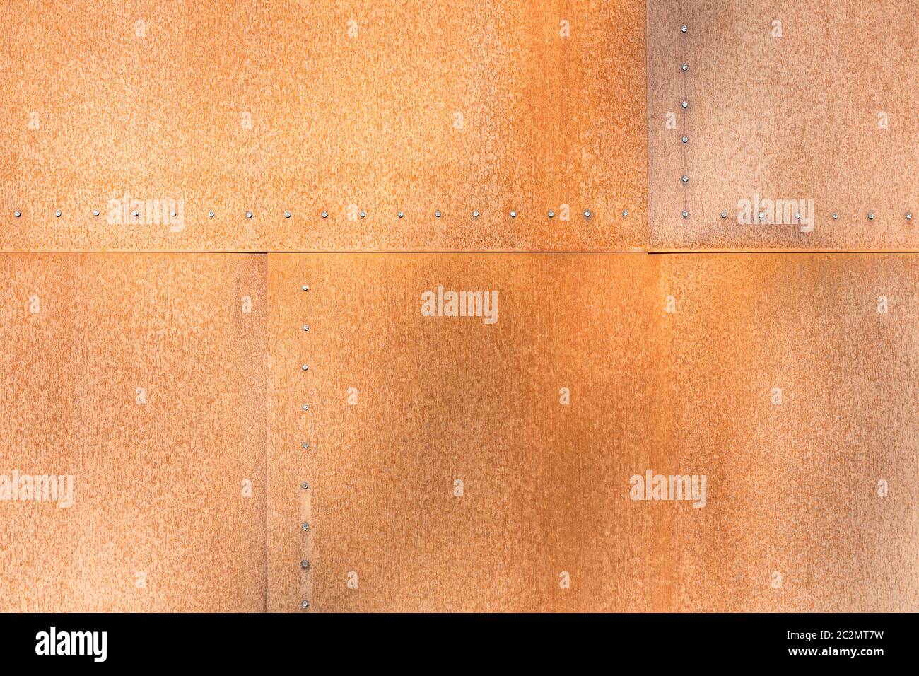 Rusty metal with small rivets as background Stock Photo - Alamy